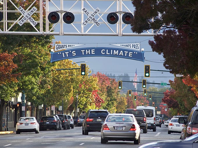 Fall colors frame Grants Pass's famous sign like nature's own welcome committee. Those trees are showing off more than the banner!