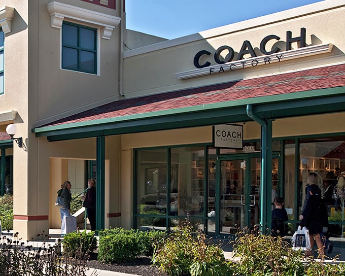 Modern retail therapy meets small-town charm in walkways designed for serious bargain hunting sessions.