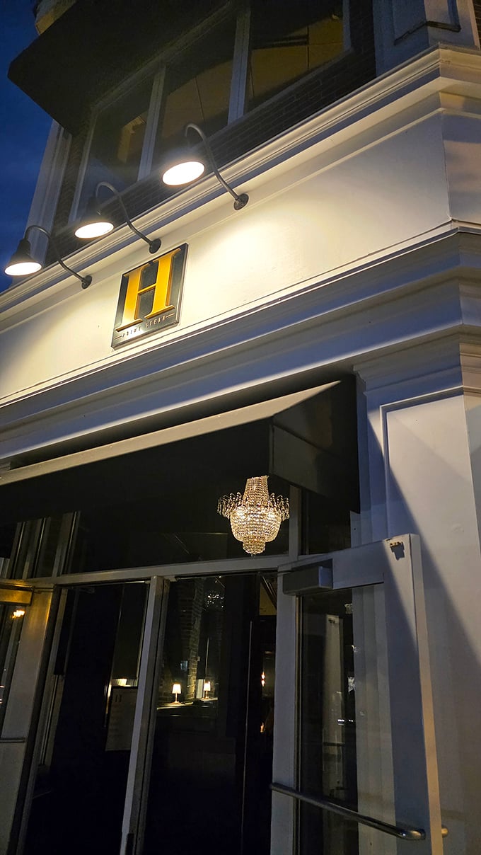 That golden "H" and crystal chandelier hint at Hinsdale Prime's refined approach. Fancy without the fussiness—my kind of place!
