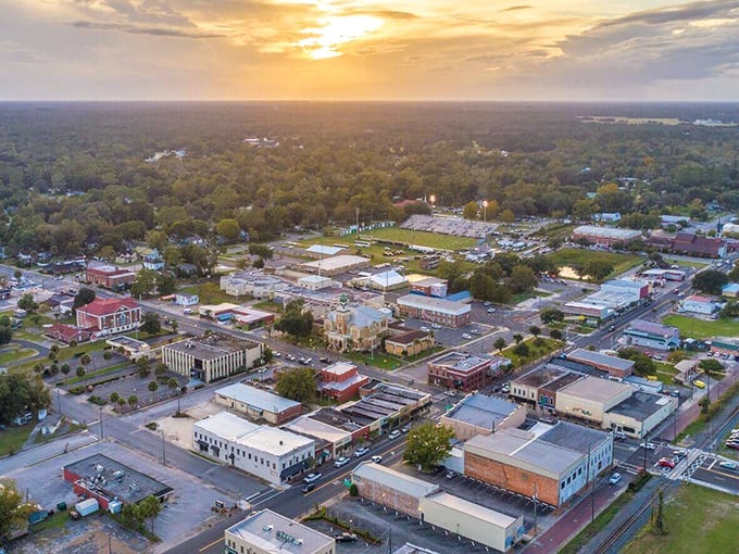 Sunset bathes Live Oak in golden light, showcasing its affordable small-town appeal. Your Social Security check goes further under these oak trees!