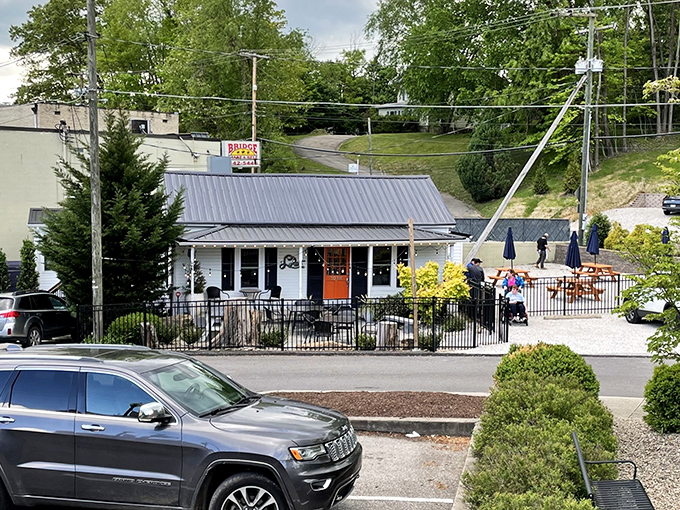 Morning light reveals Lola's inviting porch, where pizza pilgrims gather for slices that taste like Charleston sunshine.