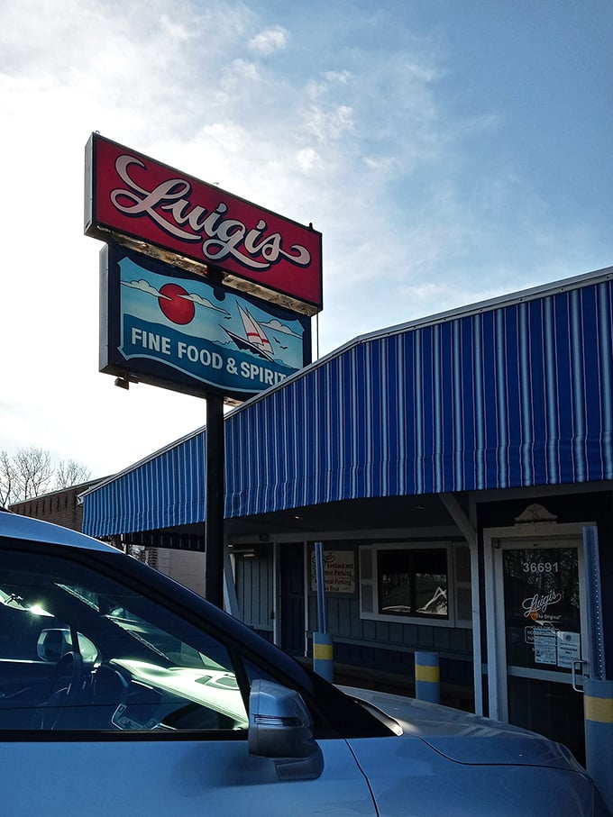 That sign says it all - "Fine Food & Spirits." Luigi's classic lakeside charm is pure Michigan nostalgia.