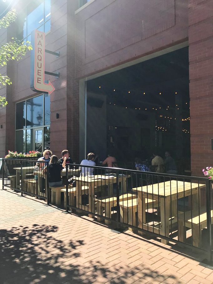 Red umbrellas, outdoor tables, and pizza that makes you forget you're in Iowa, not Italy.