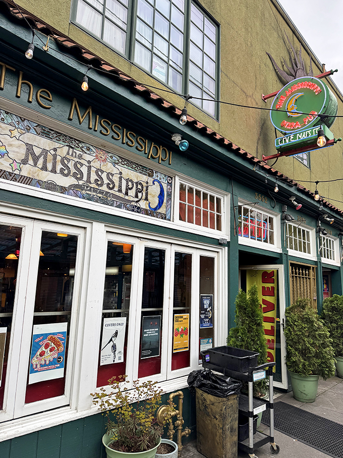 That mosaic sign isn't just decoration &ndash; it's a colorful preview of the creative pizza artistry waiting inside.