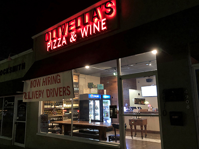 Olivella's Pizza and Wine: "Neon signs and pizza dreams. Small in size but mighty in flavor &ndash; just like the best Italian nonnas!"