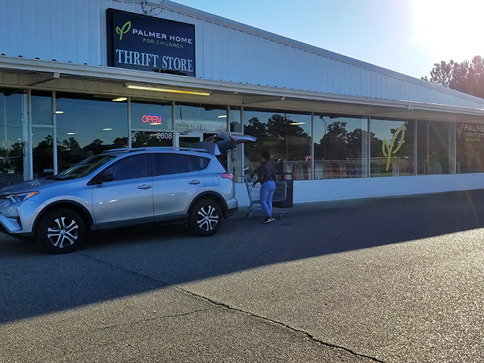 The modest exterior of Palmer Home Thrift Store gives no hint of the bargain bonanza waiting just beyond those glass doors.