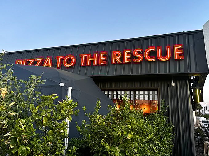 When hunger strikes, those glowing red letters are like a superhero signal in the night. No cape required, just an appetite for seriously good pizza.