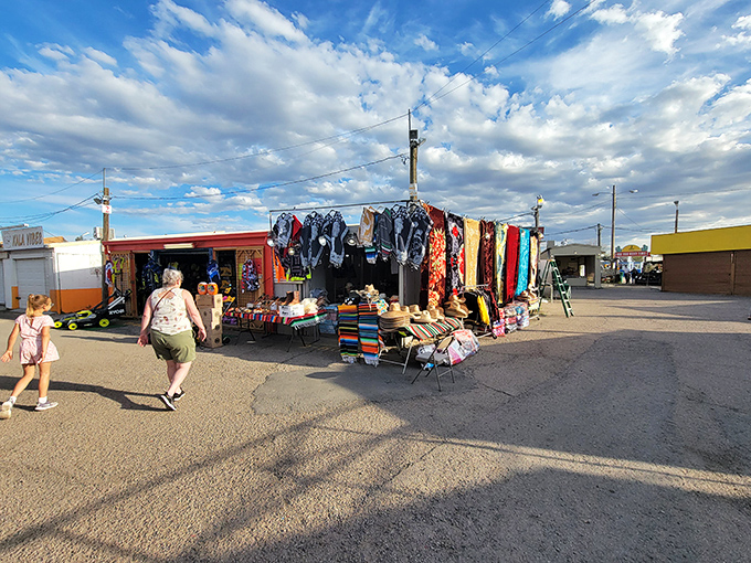 Tucson's night market glows with possibility under blue canopies. The perfect place to find that shirt you didn't know you desperately needed.