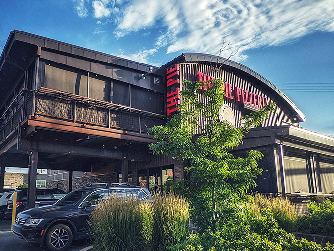 Blue skies frame The Pie's distinctive building - it's like the pizza gods designed their own temple of cheese and dough.
