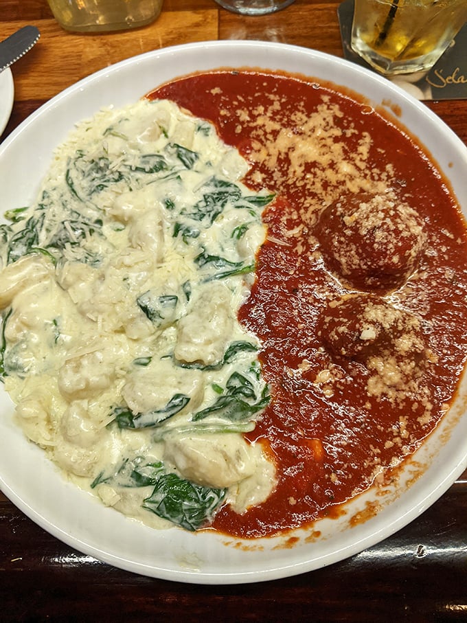 This half-and-half plate is banking on contrast&mdash;creamy spinach gnocchi meets robust tomato sauce and meatballs in perfect harmony.