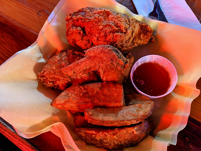 Golden-brown perfection that makes you question every other fried chicken you've ever had. The crunch is audible three tables away.