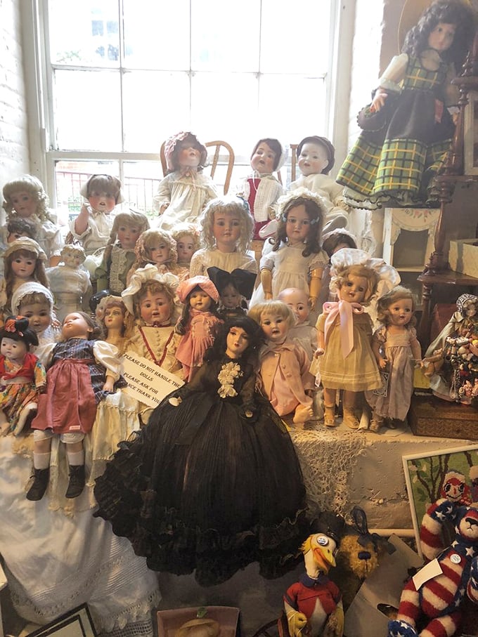 An army of antique dolls stands in eerie formation, their porcelain faces frozen in time&mdash;childhood treasures or tonight's nightmare fuel? You decide.