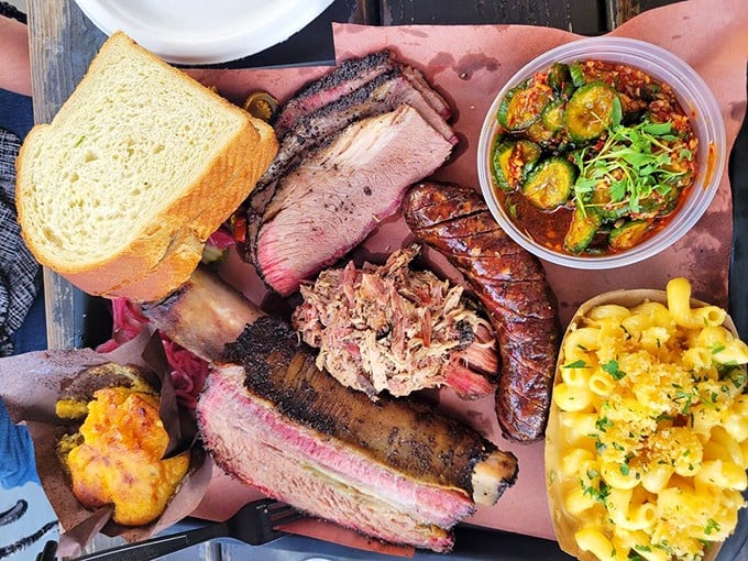 Meat paradise on pink butcher paper&mdash;where brisket, ribs, and pulled pork converge with mac and cheese that deserves its own ZIP code.