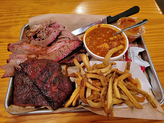 BBQ nirvana on a metal tray. That smoke ring on the brisket is like nature's way of saying, "You've made an excellent life decision today."