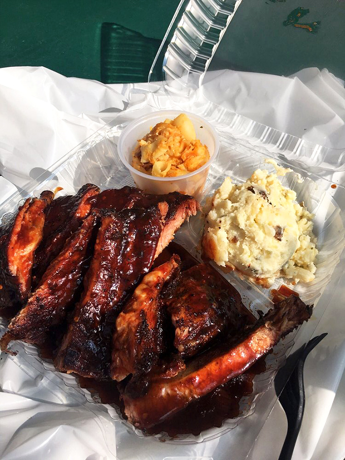 These ribs don't just fall off the bone &ndash; they practically leap onto your fork, glistening with that signature sauce that haunts dreams.