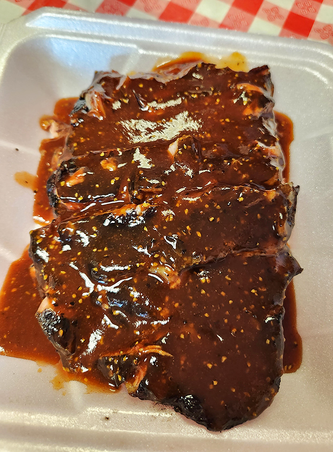 These ribs aren't just glazed, they're practically lacquered with a sauce that's equal parts sweet, tangy, and "where have you been all my life?" The perfect bark-to-meat ratio is barbecue poetry.