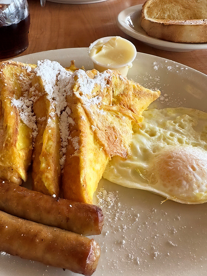 French toast dusted with powdered sugar like fresh Washington snow, alongside eggs cooked exactly how you asked&mdash;a morning miracle.