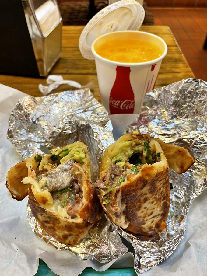 Behold the cross-section of greatness! This foil-wrapped treasure reveals its secrets: perfectly layered ingredients with no unnecessary rice filler in sight.