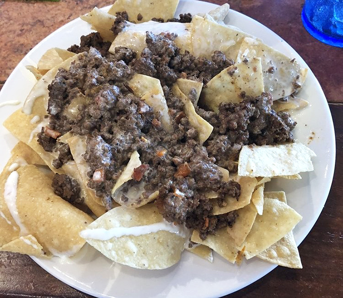 These beef nachos aren't just a snack, they're an architectural achievement&mdash;layers of crispy chips supporting the weight of expectations and perfectly seasoned meat.