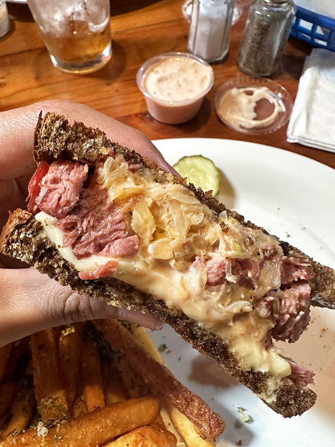 Behold the Blackstone Reuben in all its glory&mdash;corned beef, sauerkraut, and Swiss cheese performing a perfect harmony between marble rye.