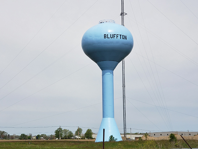 The Bluffton water tower stands tall against the Indiana sky, a baby-blue sentinel announcing to travelers: "Yes, you've found us!"