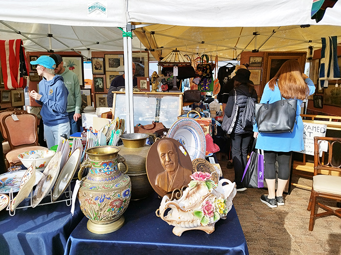 Porcelain faces from the past peer out among colorful vases and delicate dishware. One person's attic castoff becomes another's mantelpiece star.