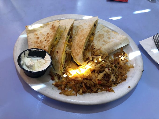 Breakfast quesadilla with a side of crispy home fries&mdash;proof that morning meals don't need to be complicated to be magnificent.