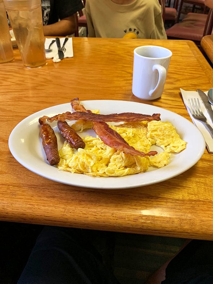 Breakfast perfection doesn't need fancy plating &ndash; just perfectly scrambled eggs, bacon with the ideal crisp-to-chew ratio, and sausage links that snap when bitten.