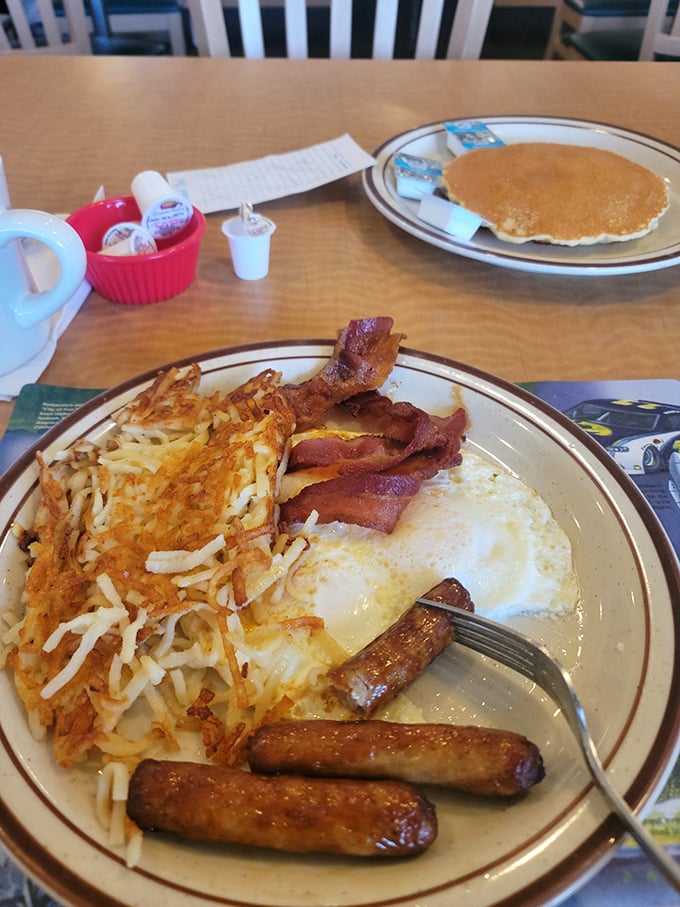 Breakfast perfection on a plate &ndash; golden hash browns with that essential crispy edge, perfectly cooked eggs, and sausage links that snap with each bite.
