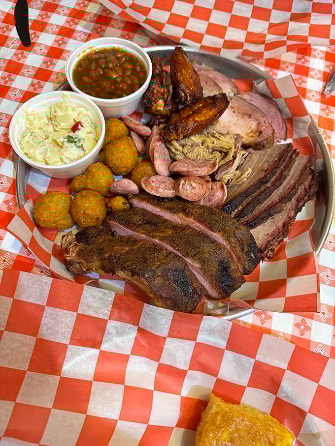 Meat symphony on a metal platter! Brisket, ribs, sausage, and sides all sharing the stage like the greatest rock supergroup ever assembled.