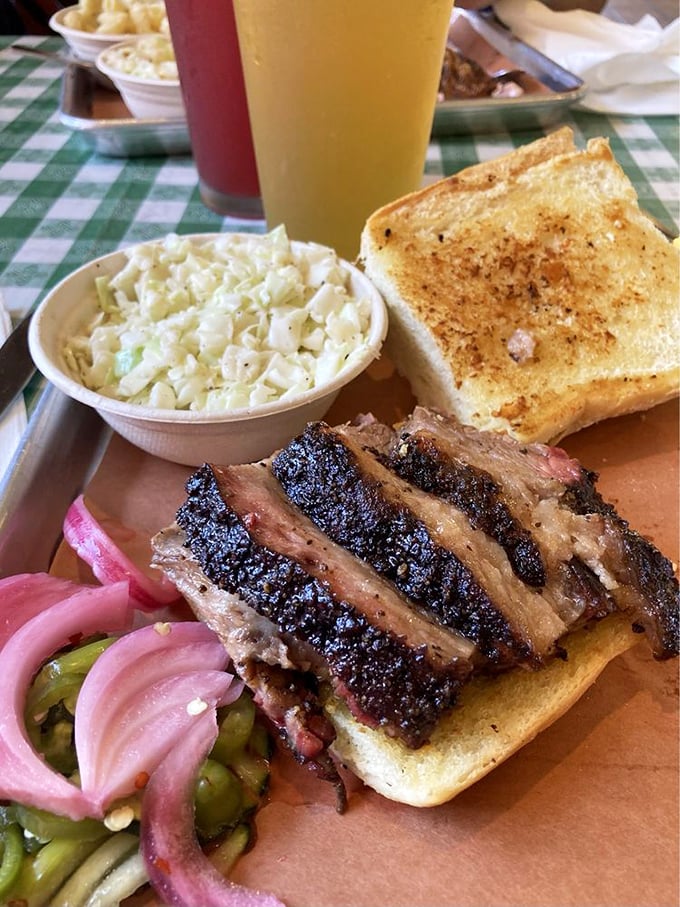 Brisket's beauty pageant winner right here. That bark, that smoke ring, those pickled onions &ndash; it's the holy trinity of barbecue perfection.