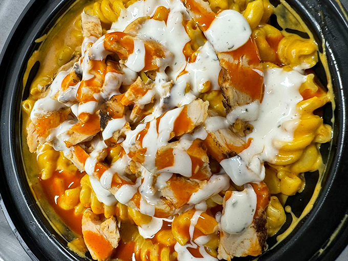 Buffalo chicken mac and cheese: where wing night meets comfort food. That drizzle of ranch is the culinary equivalent of a perfect sunset.