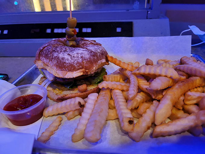 The humble burger gets its intergalactic upgrade here, served alongside crinkle-cut fries that would make any space smuggler feel right at home.