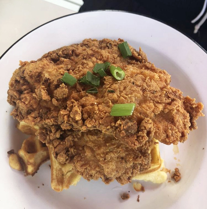 That buttermilk fried chicken isn't just crispy &ndash; it's wearing a golden armor of seasoned crust that audibly shatters with each heavenly bite.