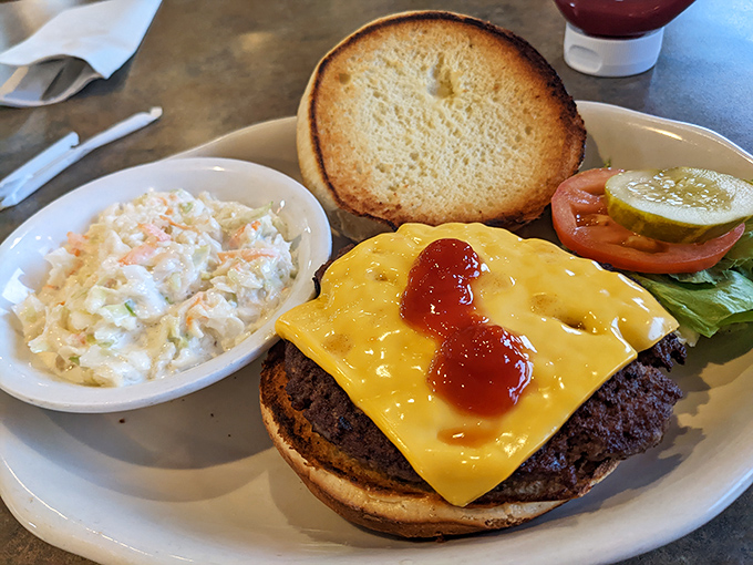 This isn't just a cheeseburger&mdash;it's a masterclass in diner perfection. The melted cheese cascades down like a yellow waterfall of happiness.