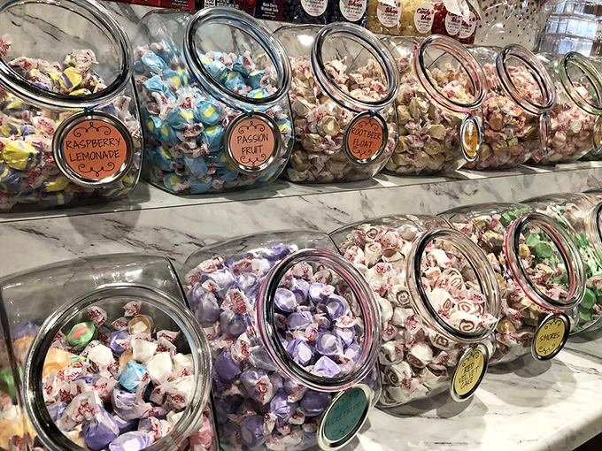 Glass jars filled with taffy treasures line the shelves like a museum of sweet possibilities.