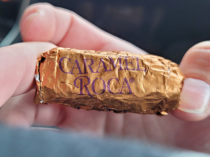 The gold-wrapped glory of Almond Roca in its natural habitat &ndash; between someone's fingers, moments before disappearing forever.