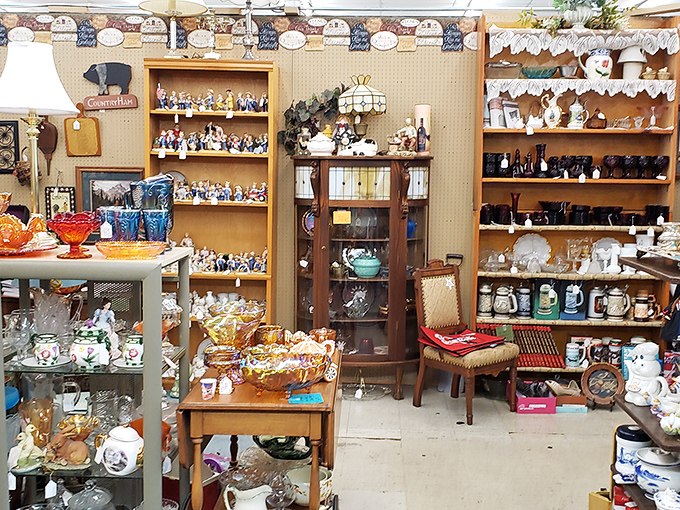 Glassware heaven! From Depression glass to mid-century treasures, these shelves hold stories in every delicate curve and colorful pattern.