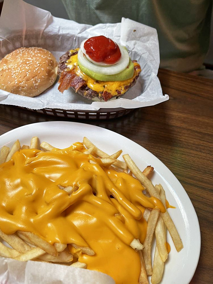 Cheese fries that don't mess around. That molten yellow blanket isn't just for show&mdash;it's the comfort food equivalent of a warm hug on a plate.