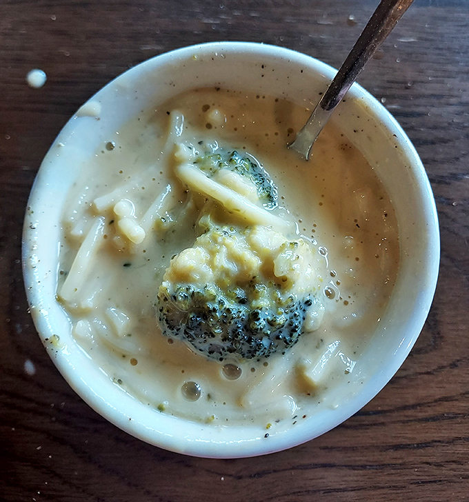 The legendary cheese soup that launches a thousand road trips&mdash;creamy, rich, and dotted with broccoli. One spoonful and you'll understand the obsession.
