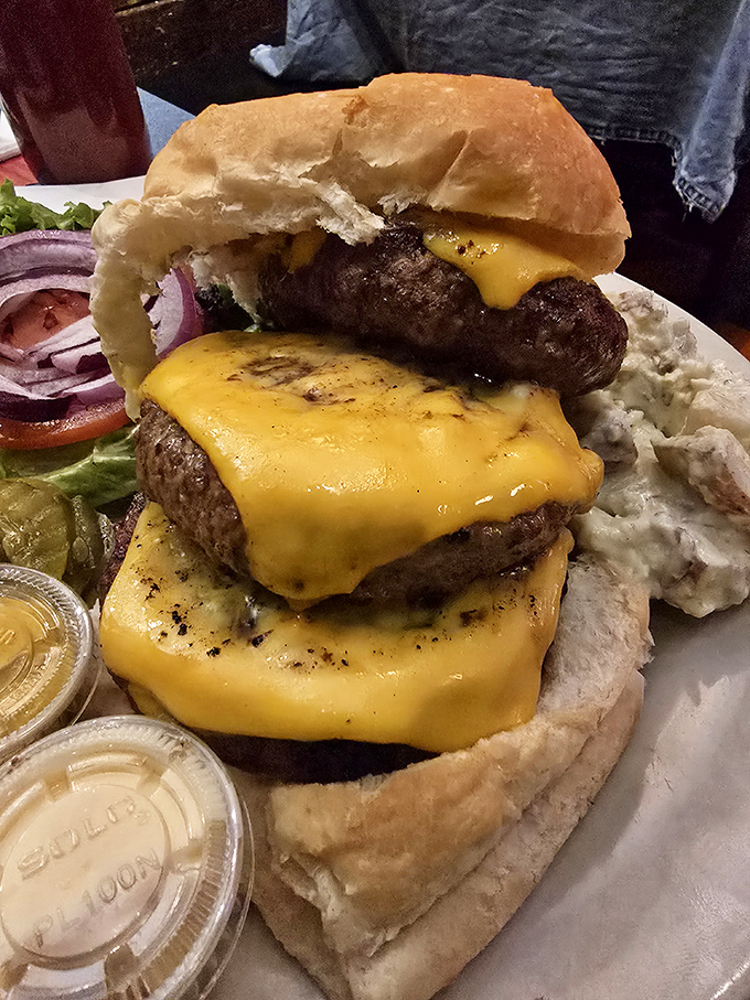 Not so much a burger as a towering monument to beef perfection. The cheese cascades like molten gold over hand-formed patties.