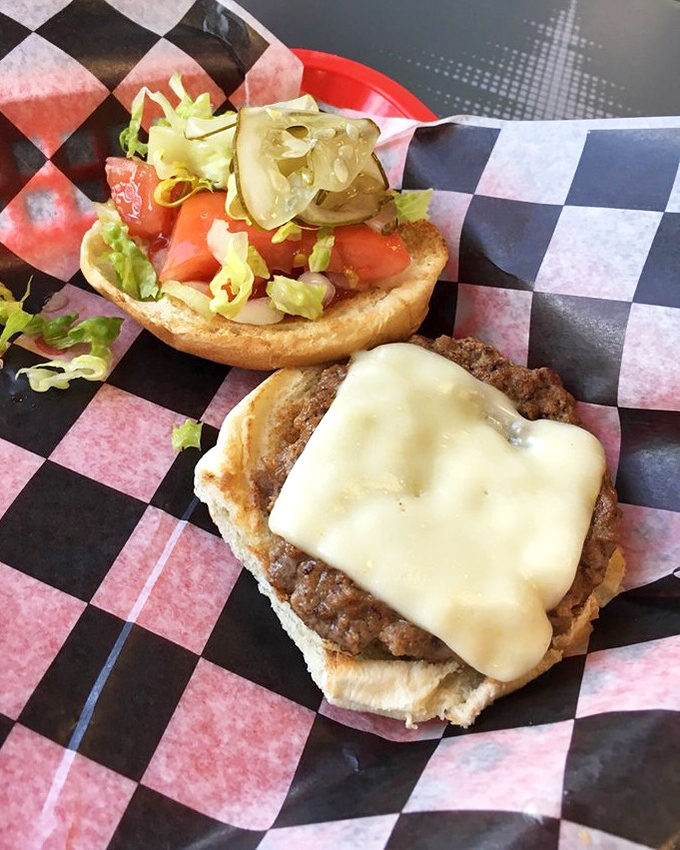 Behold the hero of our story&mdash;a perfectly melted cheese blanket hugging a seasoned patty. This isn't just lunch; it's an edible hug.