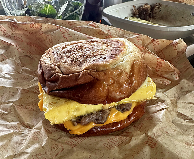 Behold the breakfast sandwich in its final, glorious form&mdash;a golden-brown bun cradling melted cheese, a perfect egg, and meat that means business.