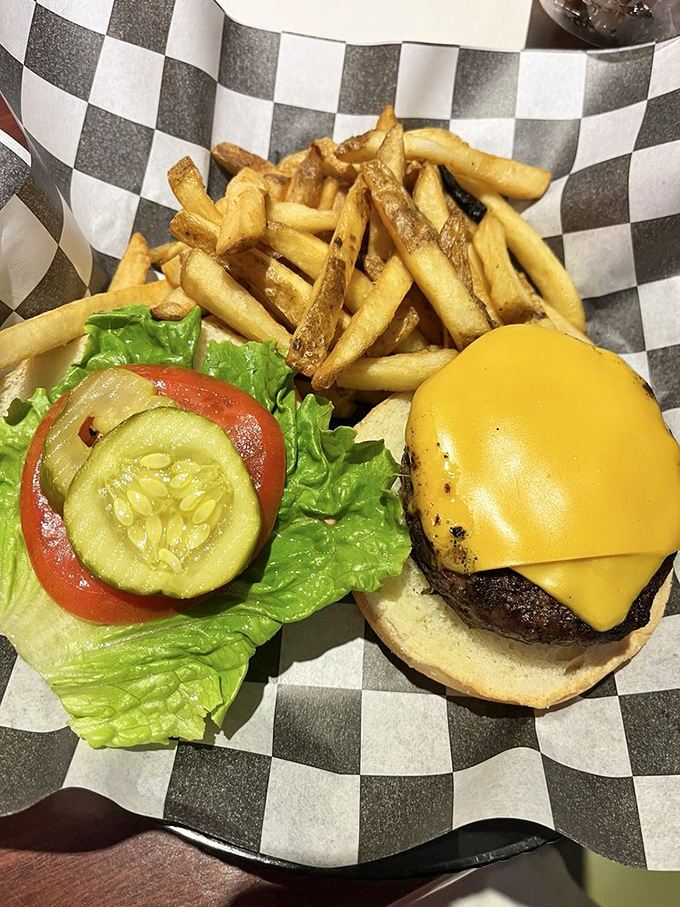Simplicity perfected: a juicy cheeseburger with fresh toppings and golden fries. Sometimes the classics don't need reinvention, just proper execution.