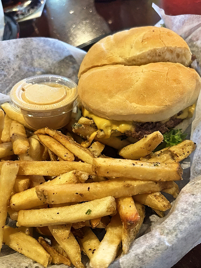 This isn't just a cheeseburger; it's a masterclass in simplicity. The golden fries aren't sidekicks&mdash;they're co-stars in this delicious production.