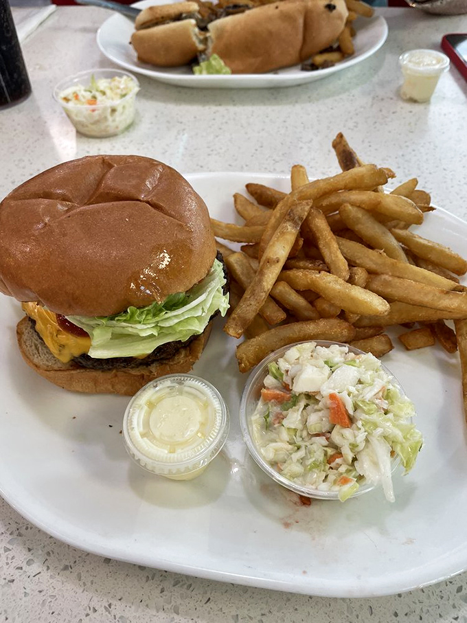 The cheeseburger arrives like a proper handshake&mdash;firm, substantial, and making a great first impression. Those hand-cut fries aren't just a side; they're co-stars. 