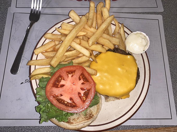 This isn't just a cheeseburger&mdash;it's edible architecture with layers of melty cheese, garden-fresh tomato, and crisp lettuce supporting a perfectly charred patty.
