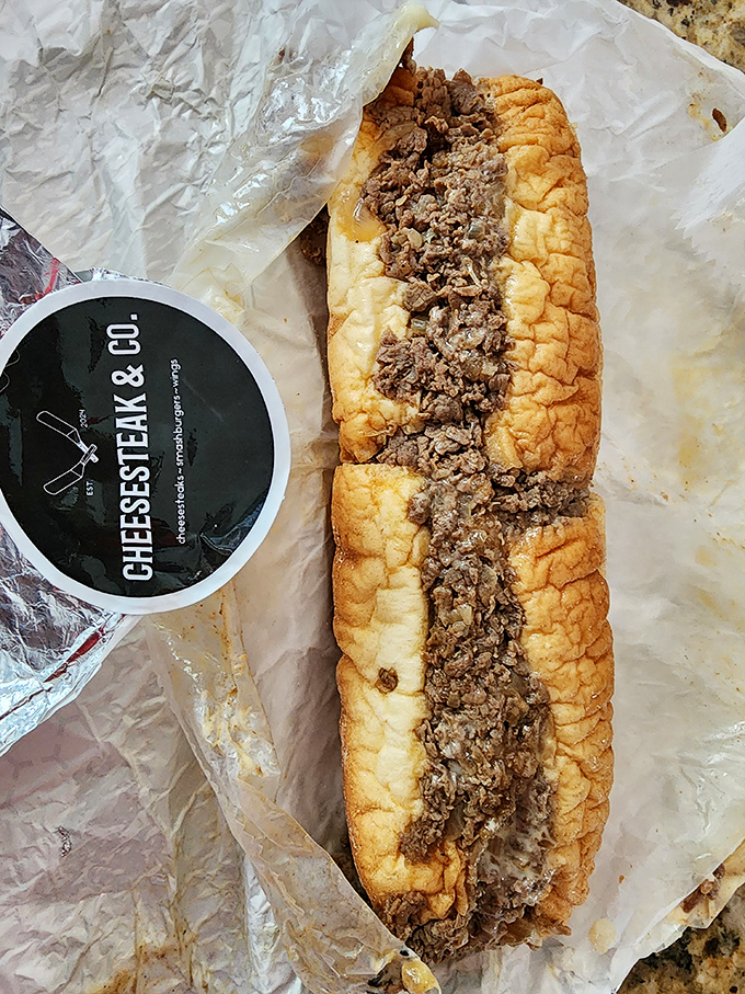 Behold the star of the show &ndash; thinly sliced beef nestled in a perfectly crusty-yet-soft roll, with every bite promising a journey to Philadelphia.