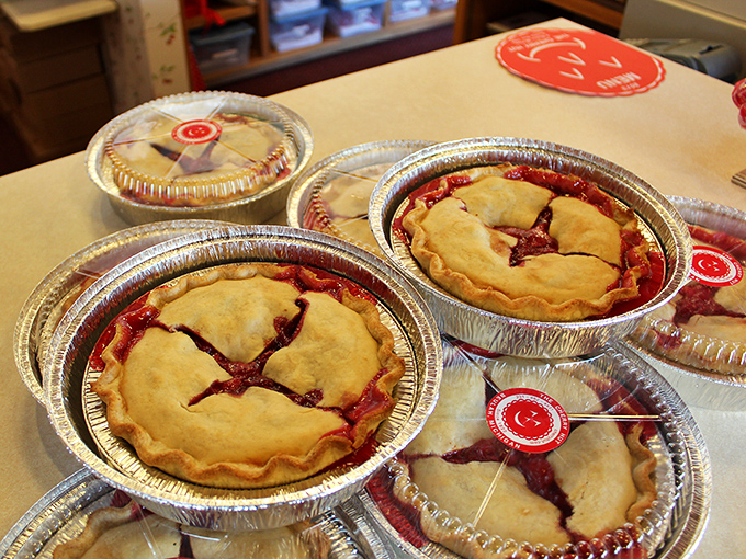 These aren't just pies—they're golden-crusted treasure chests filled with Michigan's tart-sweet rubies. Take-home versions that rarely make it all the way home.