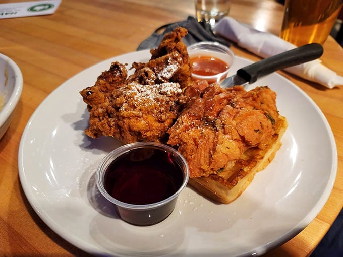 Golden-fried chicken perched atop a waffle throne with syrup and hot sauce standing by&mdash;breakfast and dinner having their most delicious argument ever.